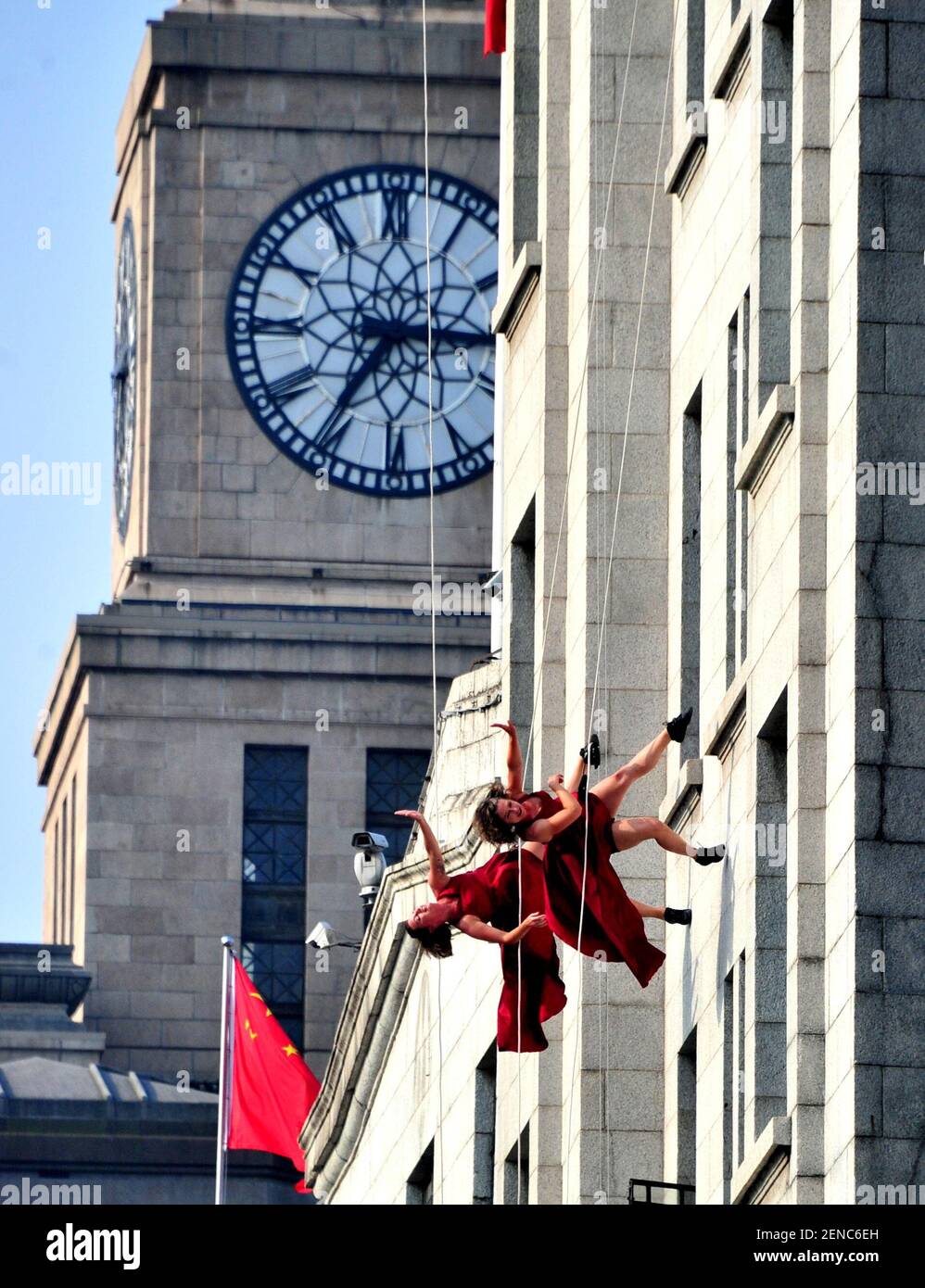 Two female acrobats from the U.S. run up the side of a wall of the AIA ...