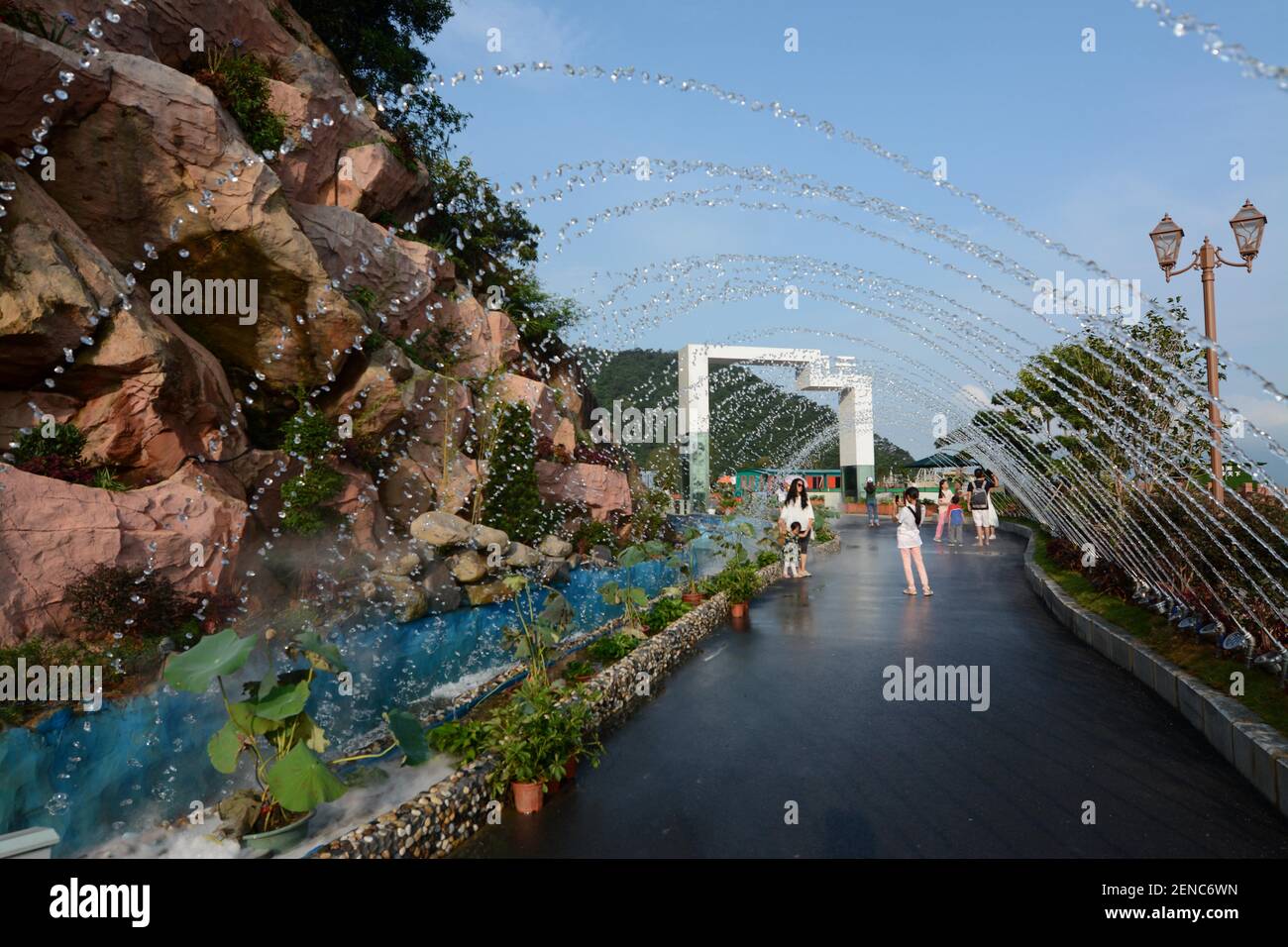 Tourists enjoy themselves at the Huangtengxia tourist attraction in ...