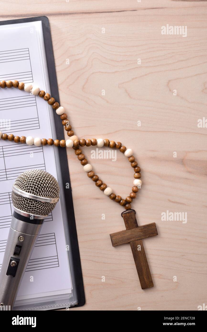 Vertical detail of Christian religious music with mic on sheet music ...