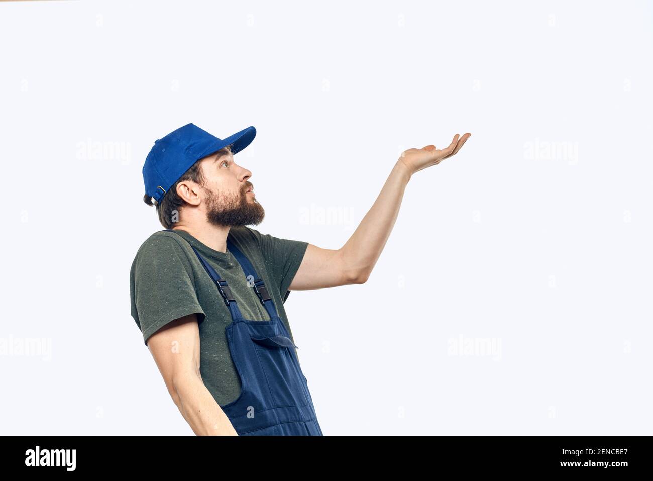 man in work uniform blue cap service work professional Stock Photo - Alamy