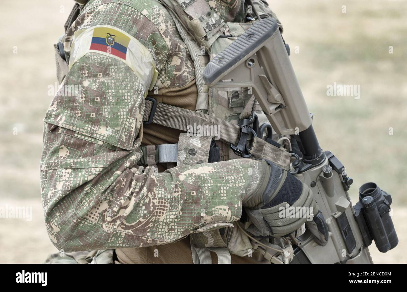 Soldier with assault rifle and flag of Ecuador on military uniform ...