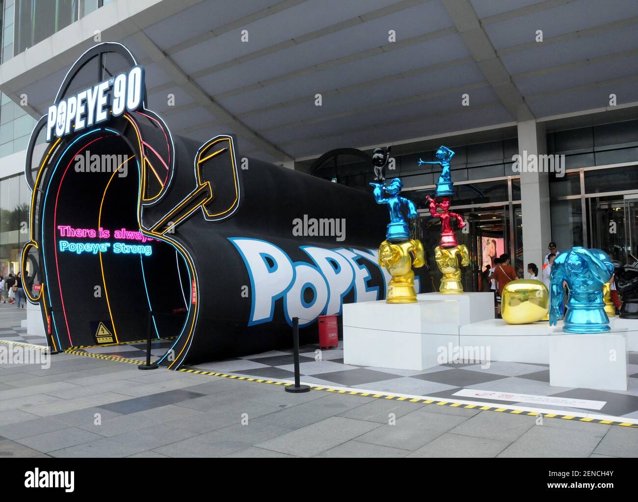 Customers view sculptures featuring cartoon character "Popeye the ...