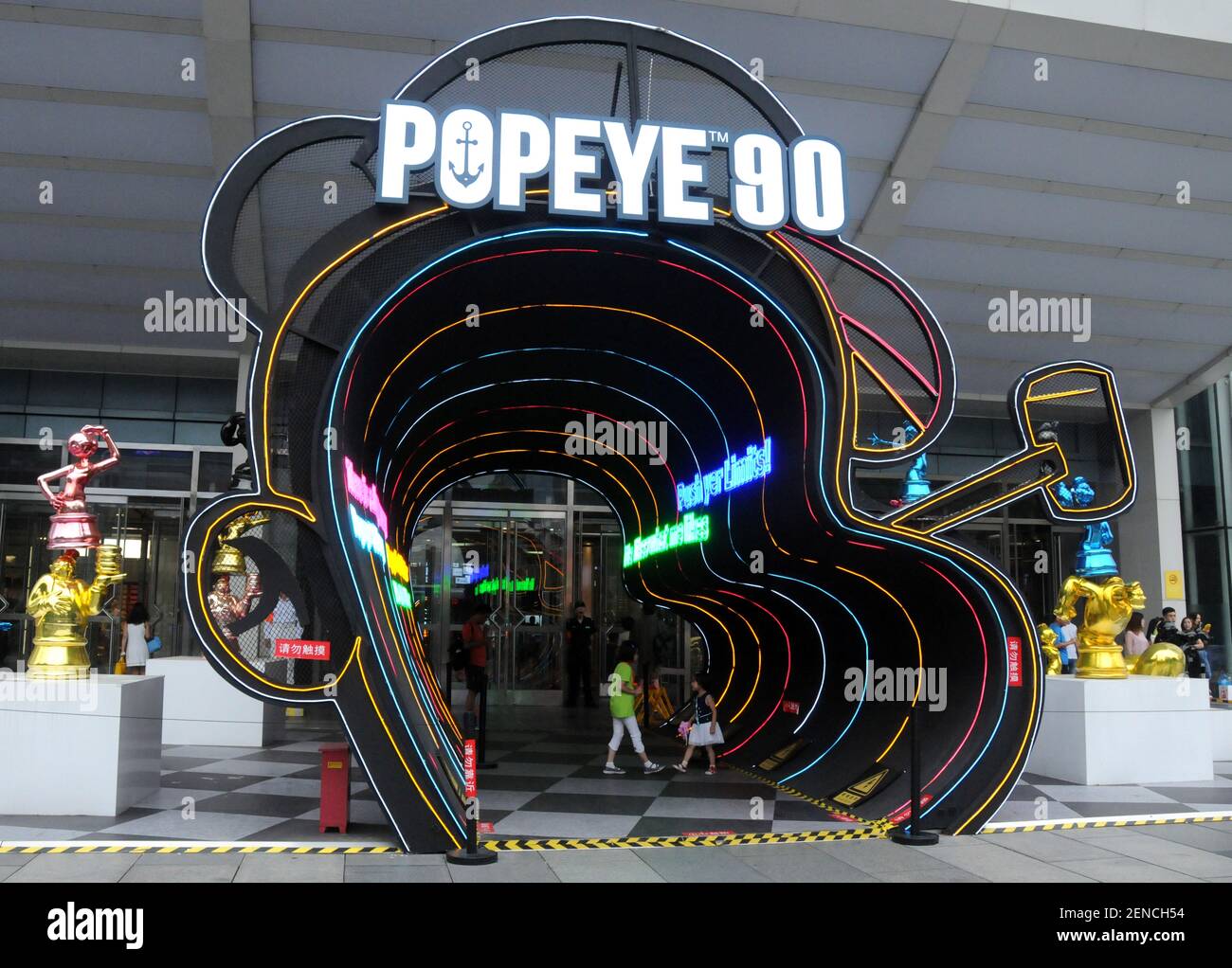 Customers view sculptures featuring cartoon character "Popeye the ...