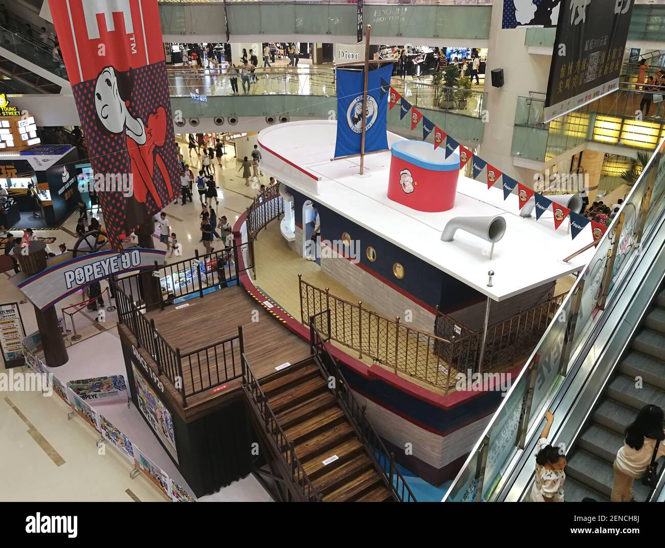 Customers view sculptures featuring cartoon character "Popeye the ...