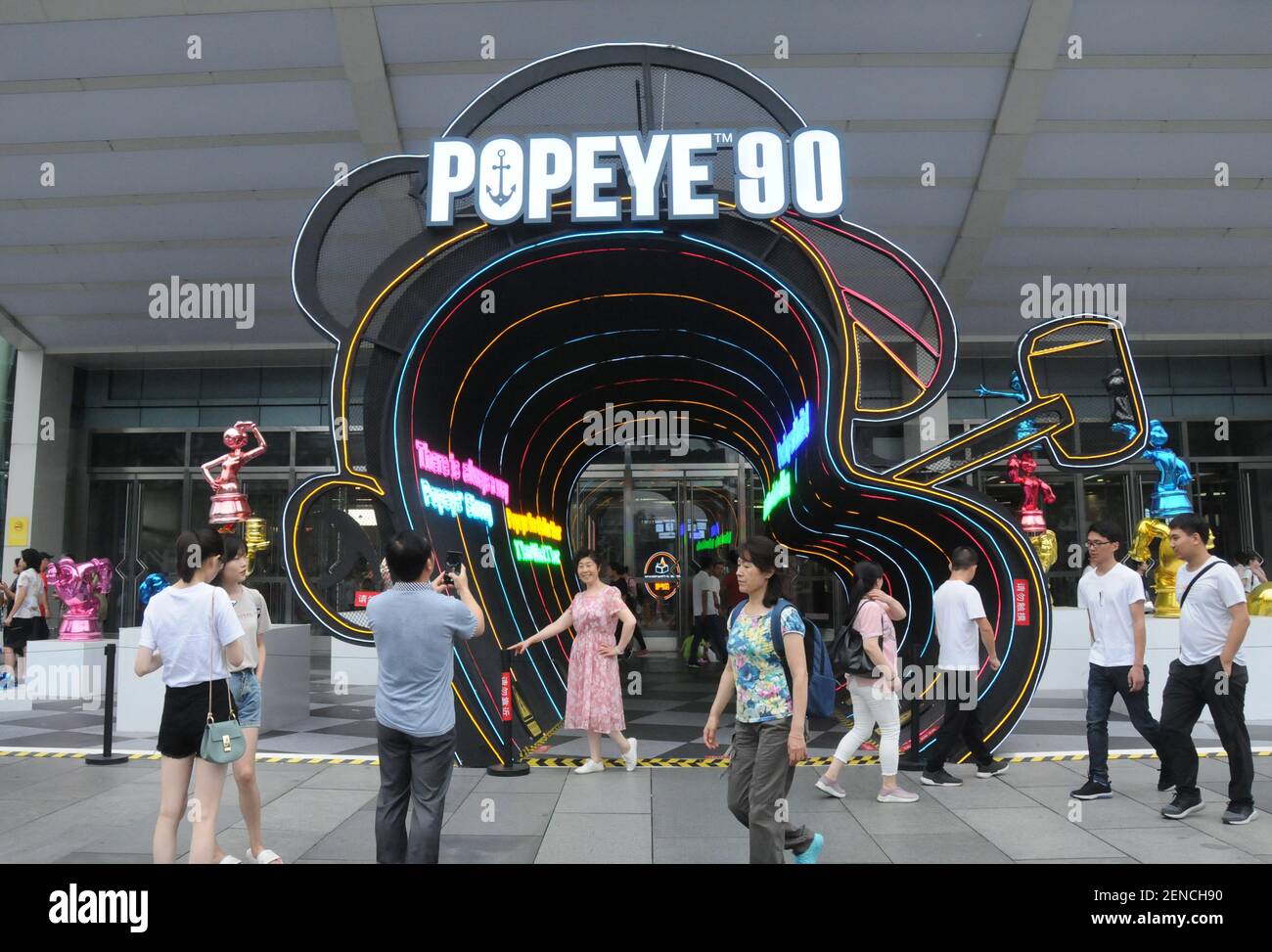 Customers view sculptures featuring cartoon character "Popeye the ...