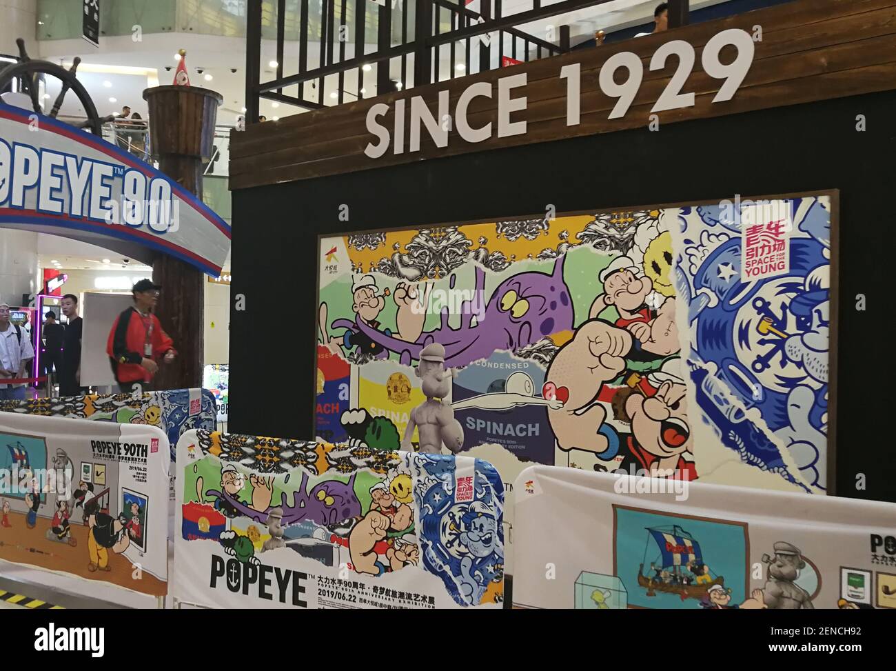 Customers view sculptures featuring cartoon character "Popeye the ...