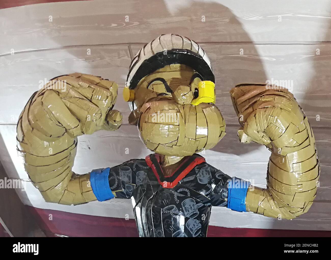 Customers view sculptures featuring cartoon character "Popeye the ...