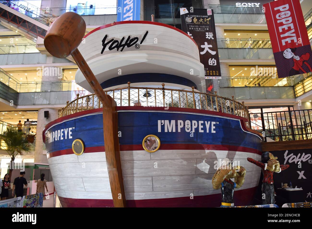 Customers view sculptures featuring cartoon character "Popeye the ...