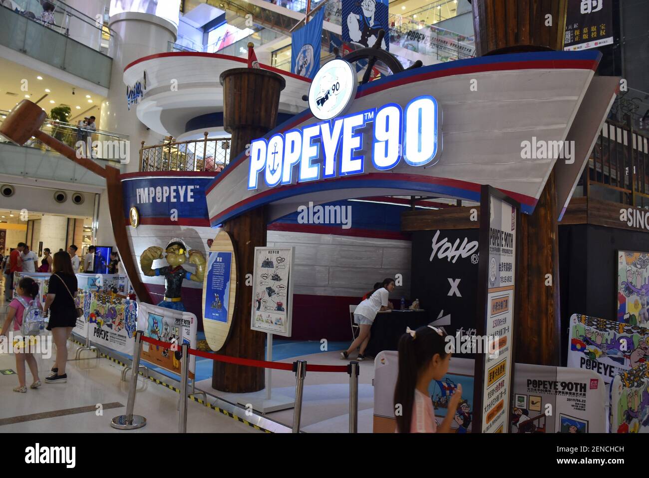 Customers view sculptures featuring cartoon character "Popeye the ...