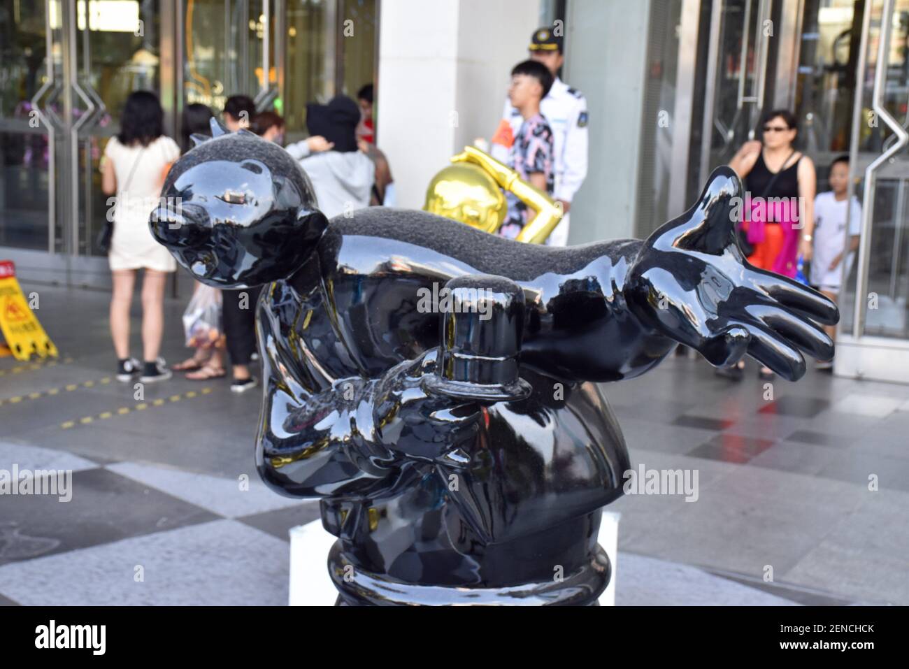 Customers view sculptures featuring cartoon character "Popeye the ...