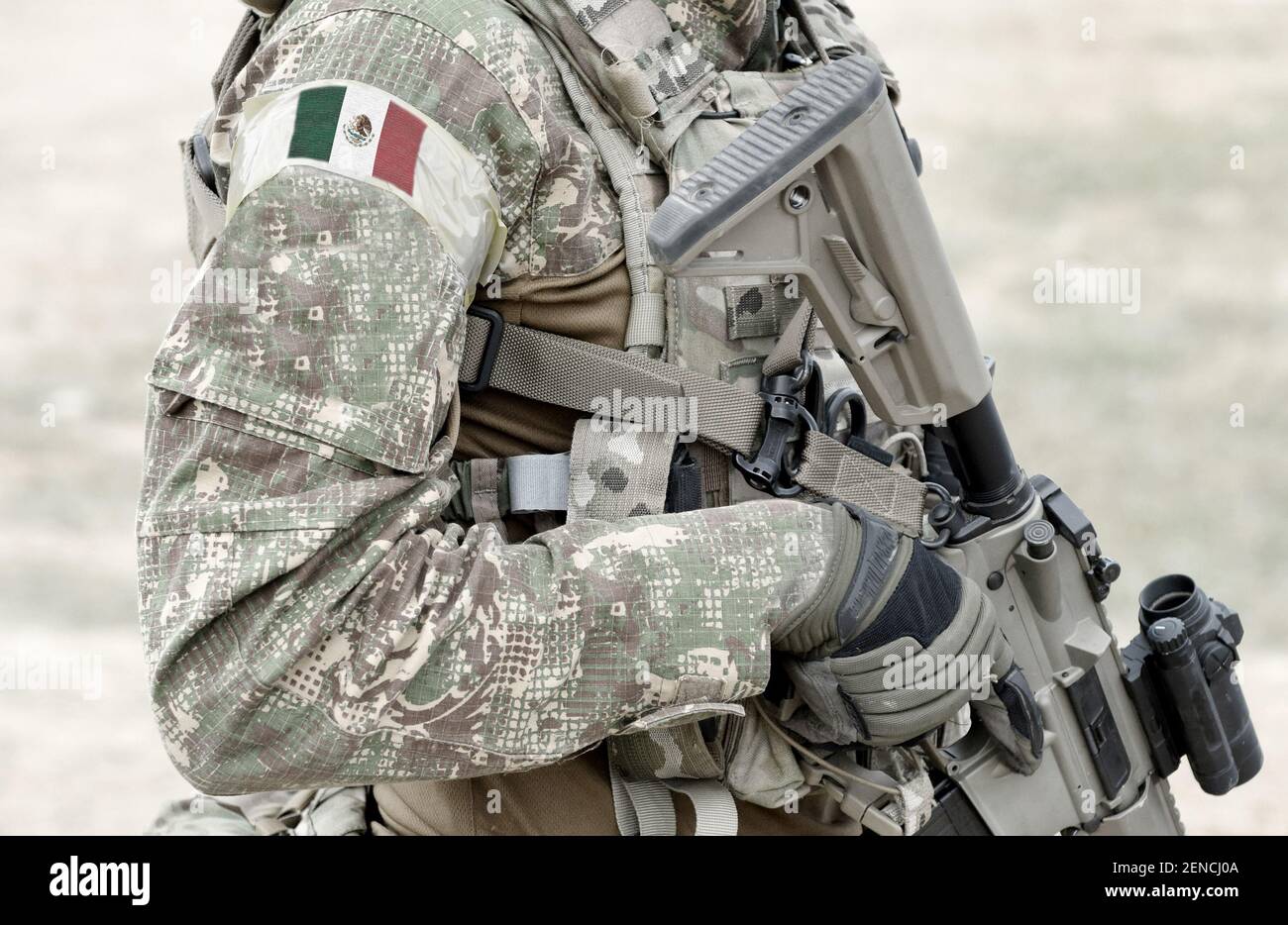 Soldier with assault rifle and flag of Mexico on military uniform. Collage Stock Photo - Alamy