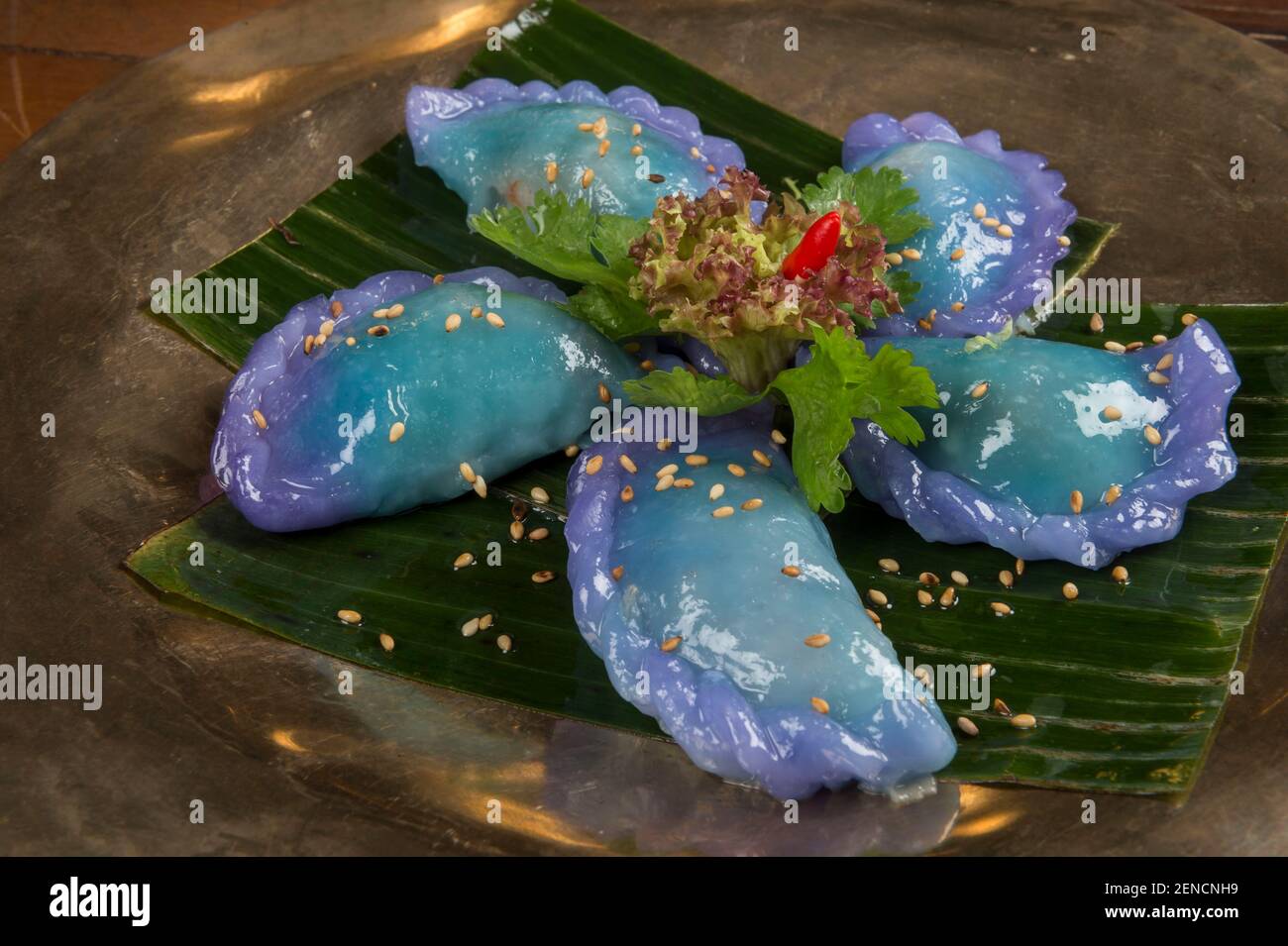 Kanom Gib Thai, rice dumpling with steamed mauve tea leaves. blue ...