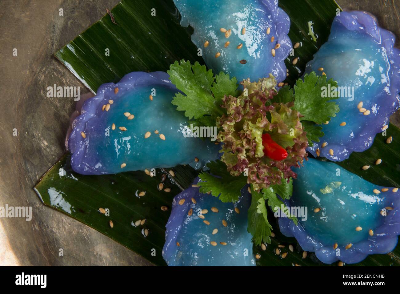 Kanom Gib Thai, rice dumpling with steamed mauve tea leaves. blue ...