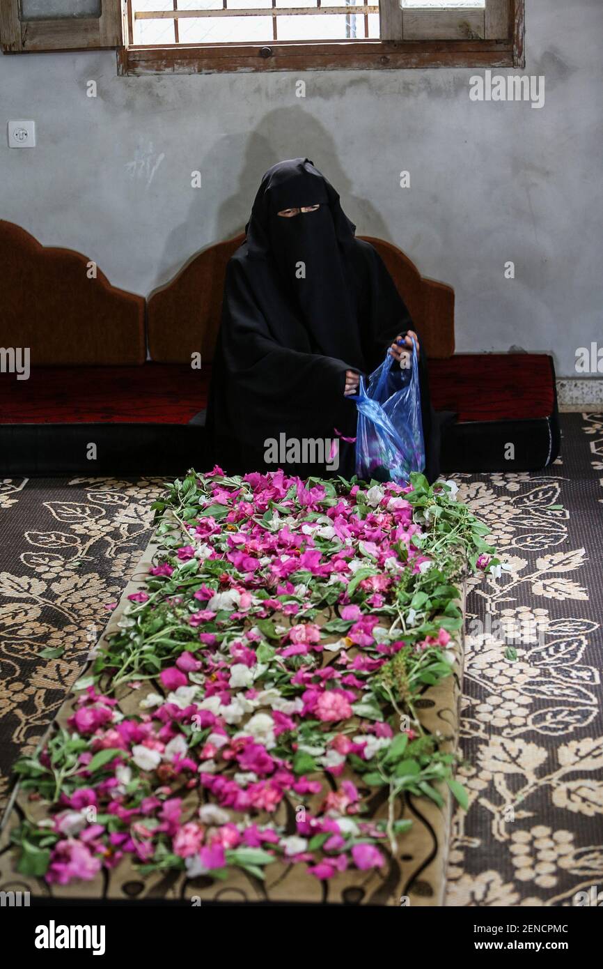 Relatives mourns of Ahmed al-Qarra, 23, during his funeral in town of ...