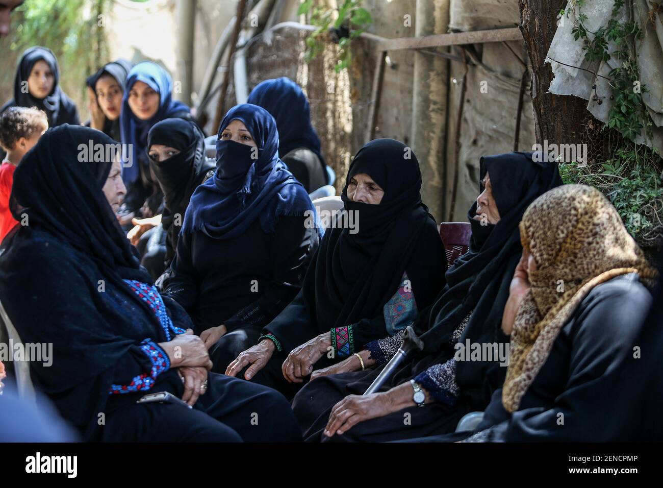 Relatives mourns of Ahmed al-Qarra, 23, during his funeral in town of ...