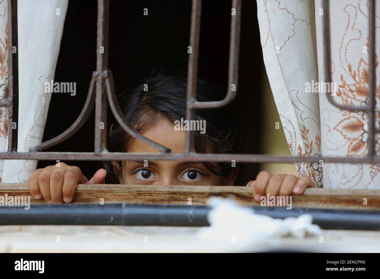 Relatives mourns of Ahmed al-Qarra, 23, during his funeral in town of ...