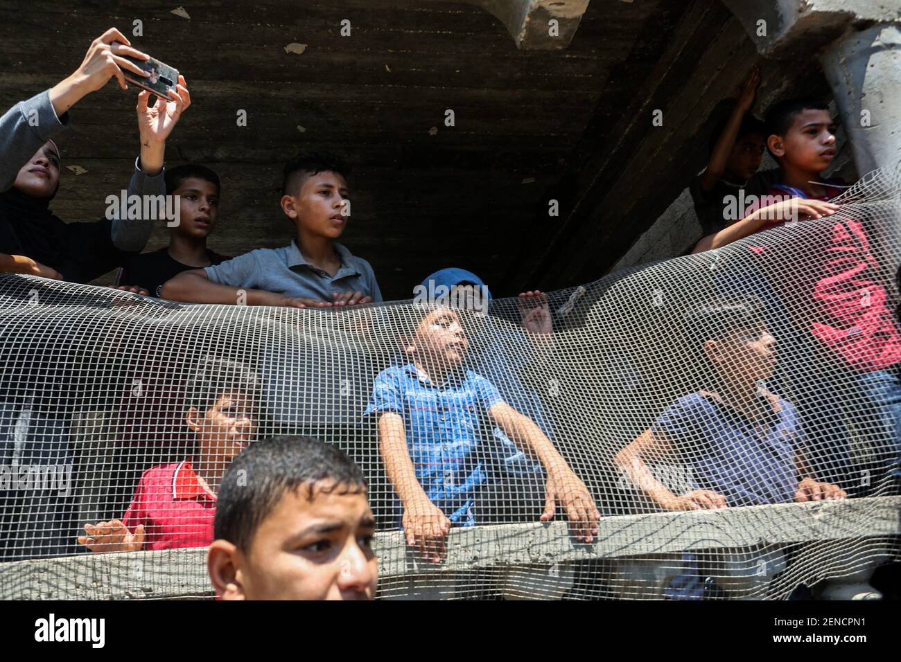 Relatives mourns of Ahmed al-Qarra, 23, during his funeral in town of ...