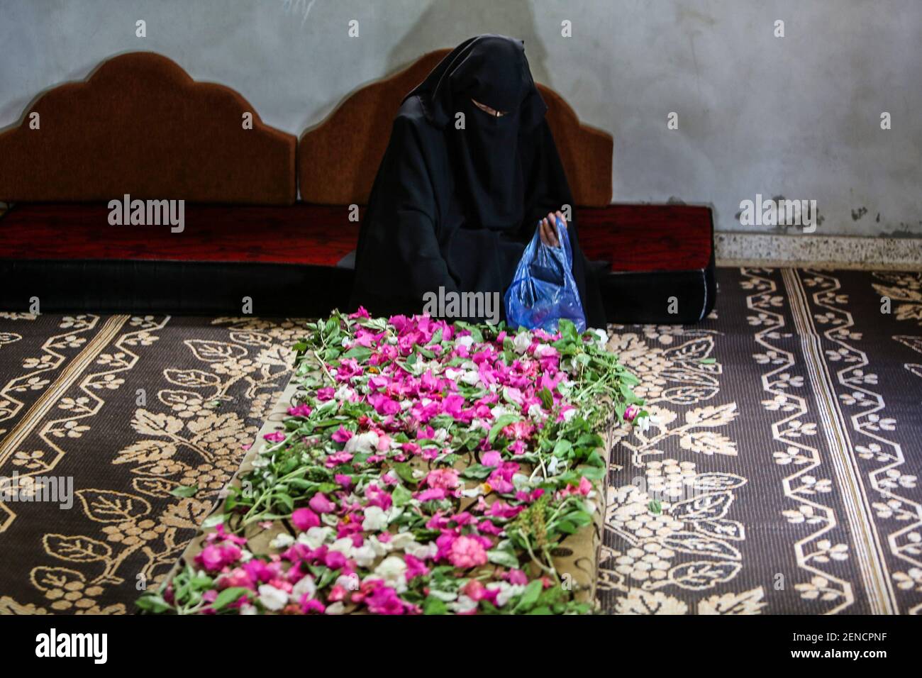 Relatives mourns of Ahmed al-Qarra, 23, during his funeral in town of ...