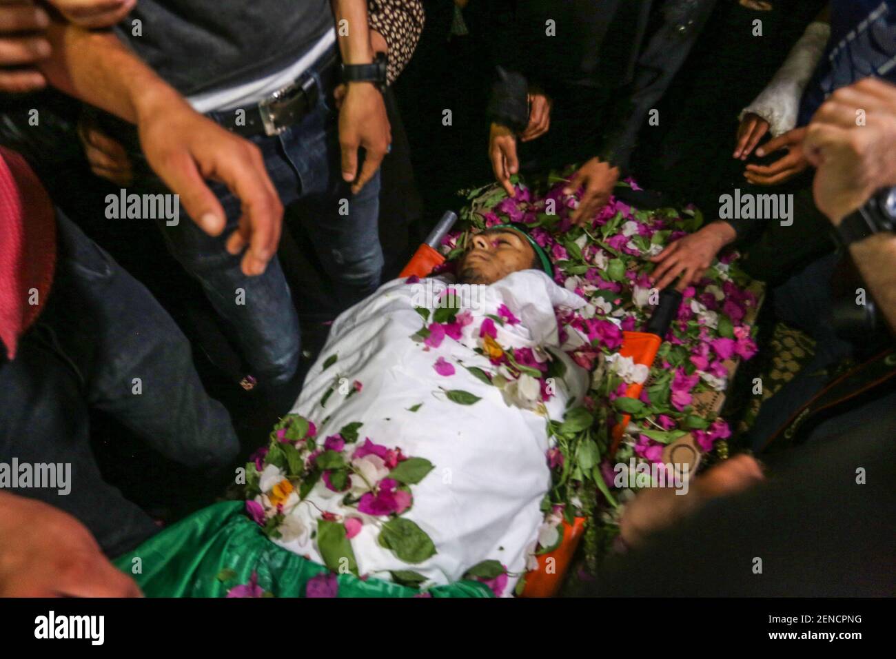 Relatives mourns of Ahmed al-Qarra, 23, during his funeral in town of ...
