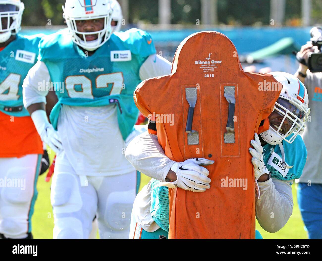 Miami Dolphins defensive tackle Akeem Grant executes a tackling drill ...
