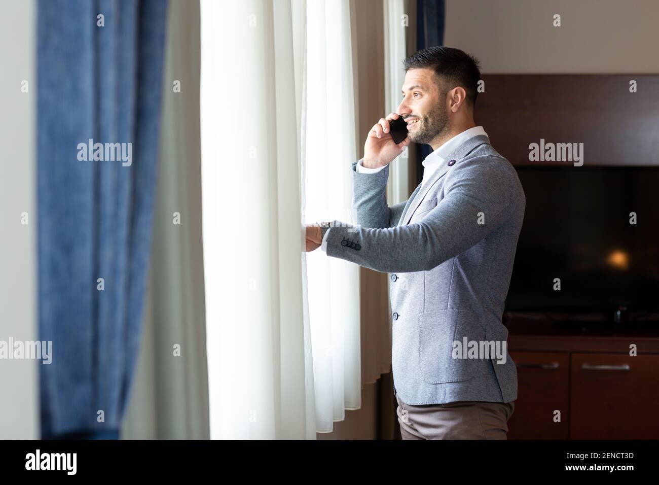 Sharp dressed businessman talking on the phone, high class lifestyle ...