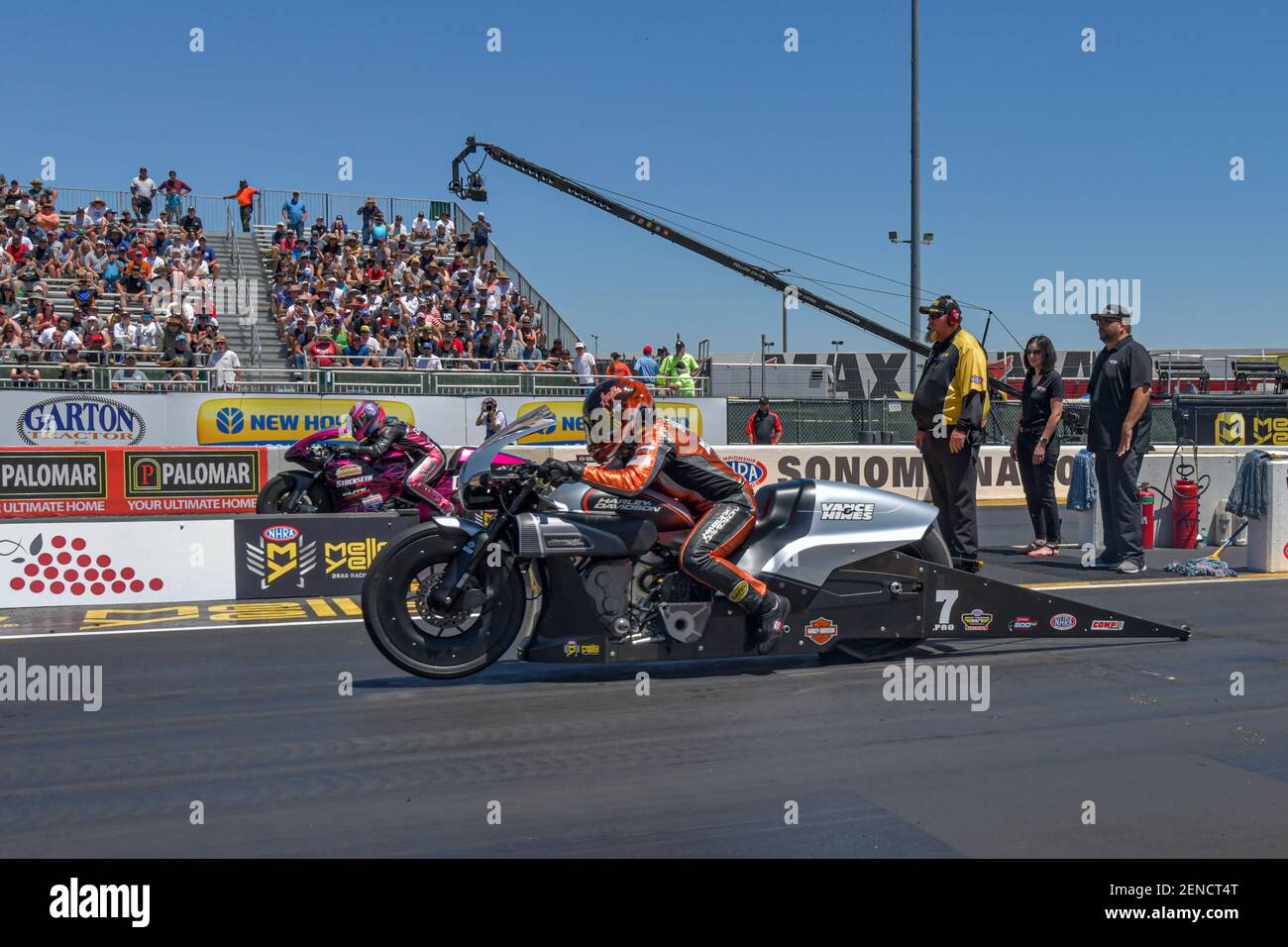 July 27, 2019: Angelle Sampey launches her pro stock bike in the left ...