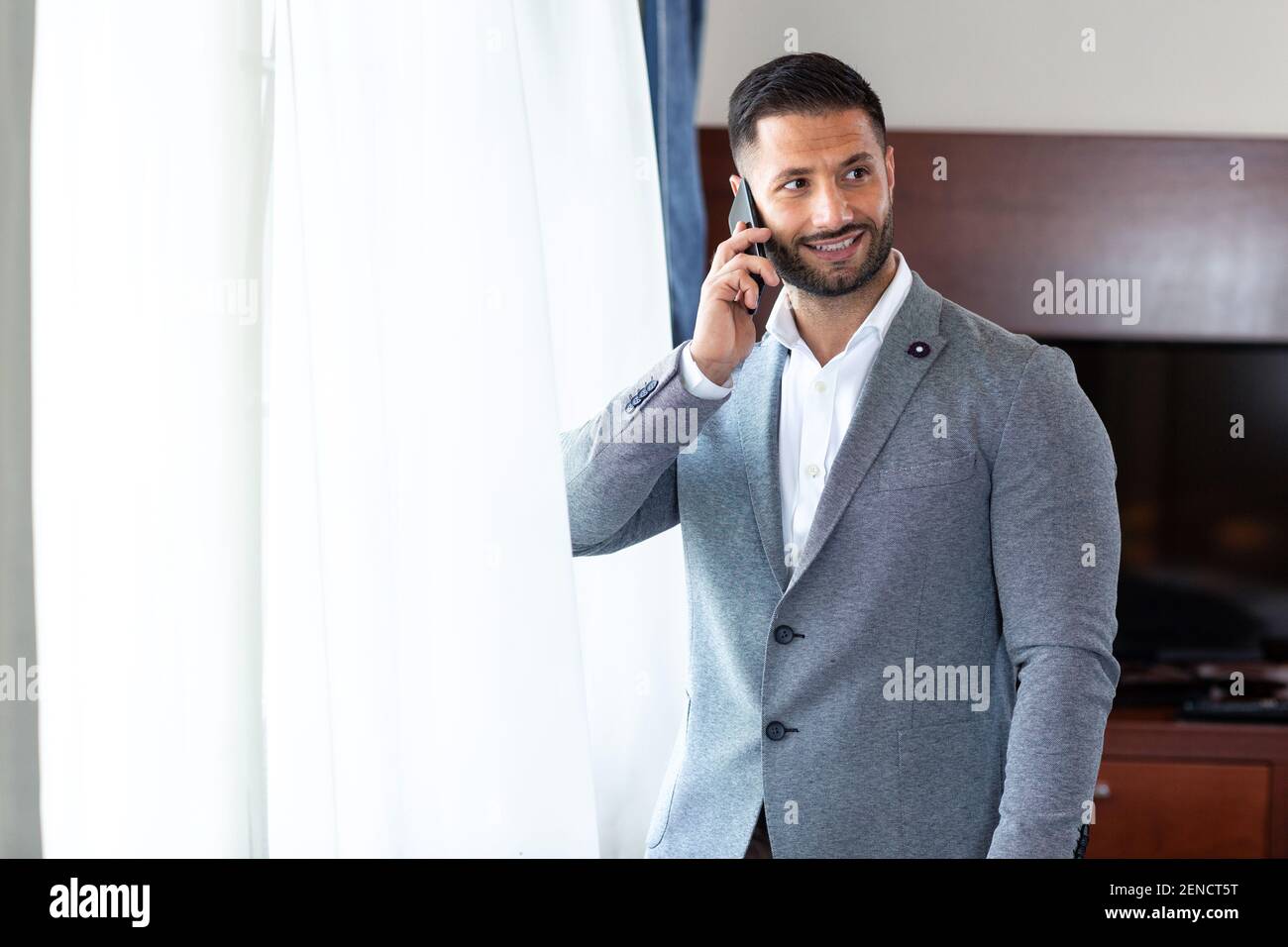 Sharp dressed man sitting hi-res stock photography and images - Alamy