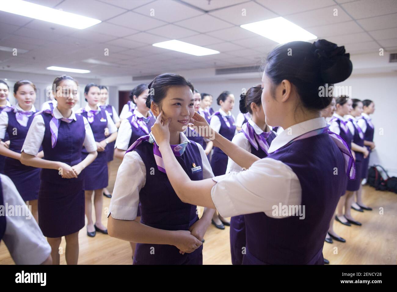 Chinese high-speed train attendants pose during a training session in ...