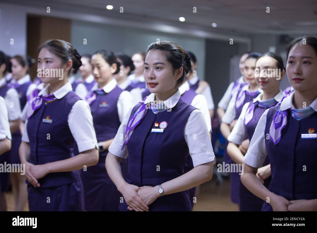 Chinese high-speed train attendants pose during a training session in Hangzhou city, east China ...