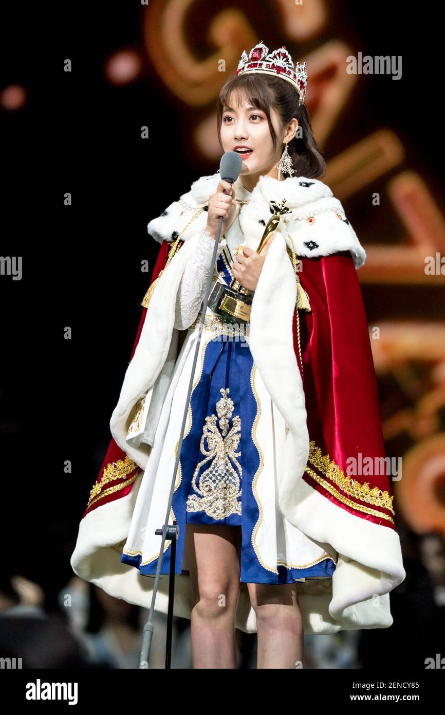 Winner Li Yitong of Chinese girl group SNH48 poses with her champion trophy during the final of ...