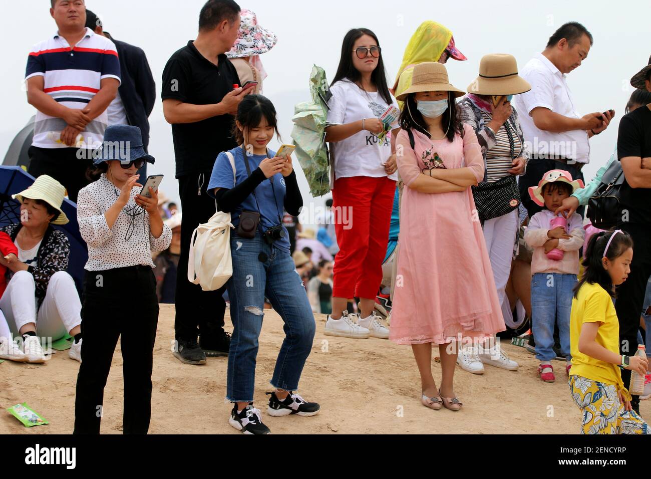 Local residents and tourists watche racing cars competing in the 2019 ...
