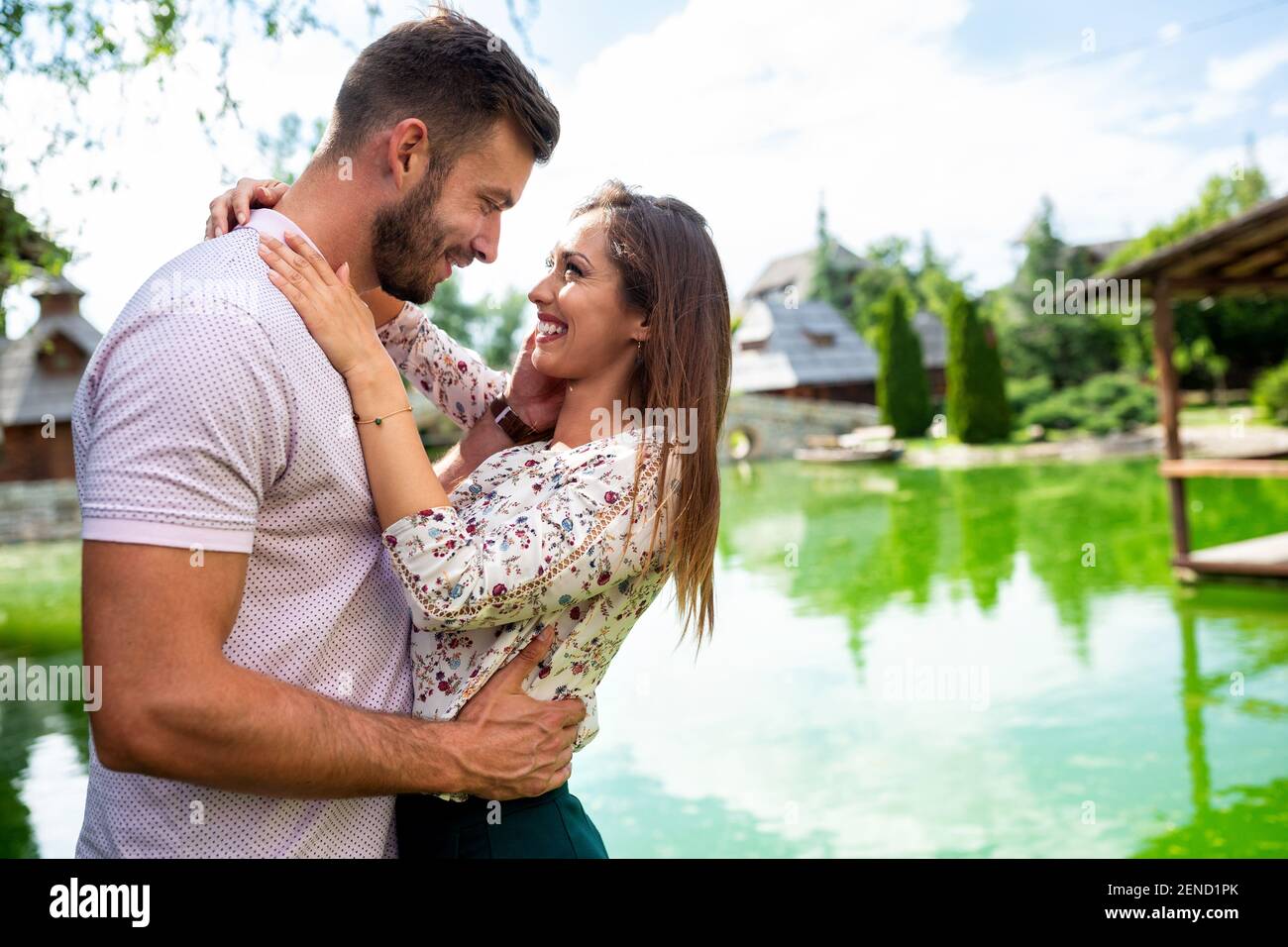 Smiling pretty woman in love with her man Stock Photo - Alamy
