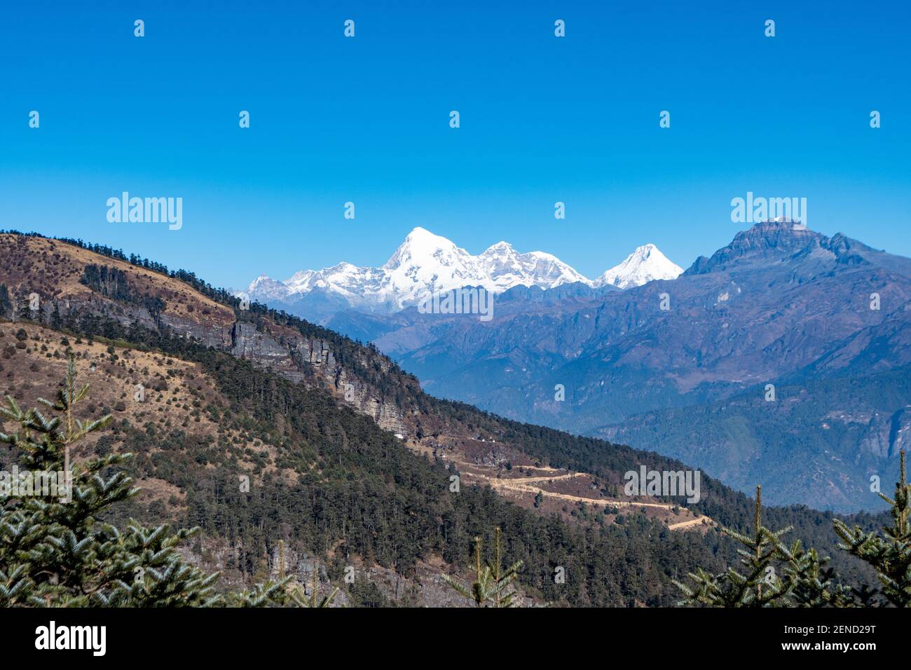 Beautiful snow capped mountain in Bhutan Stock Photo - Alamy