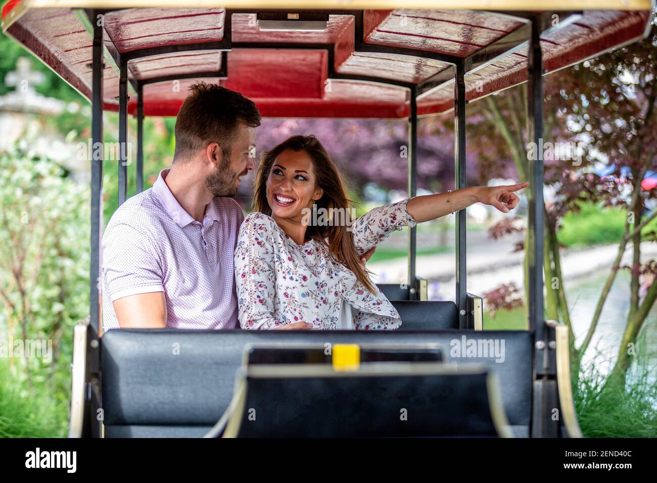 Romance on the amusement mini train ride, two people in love Stock ...