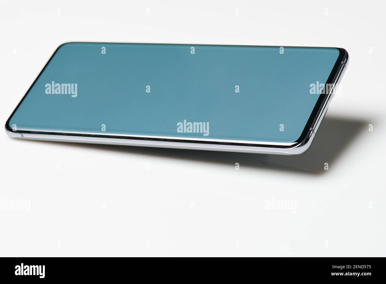 Horizontal side view of smartphone isolated on white studio background ...