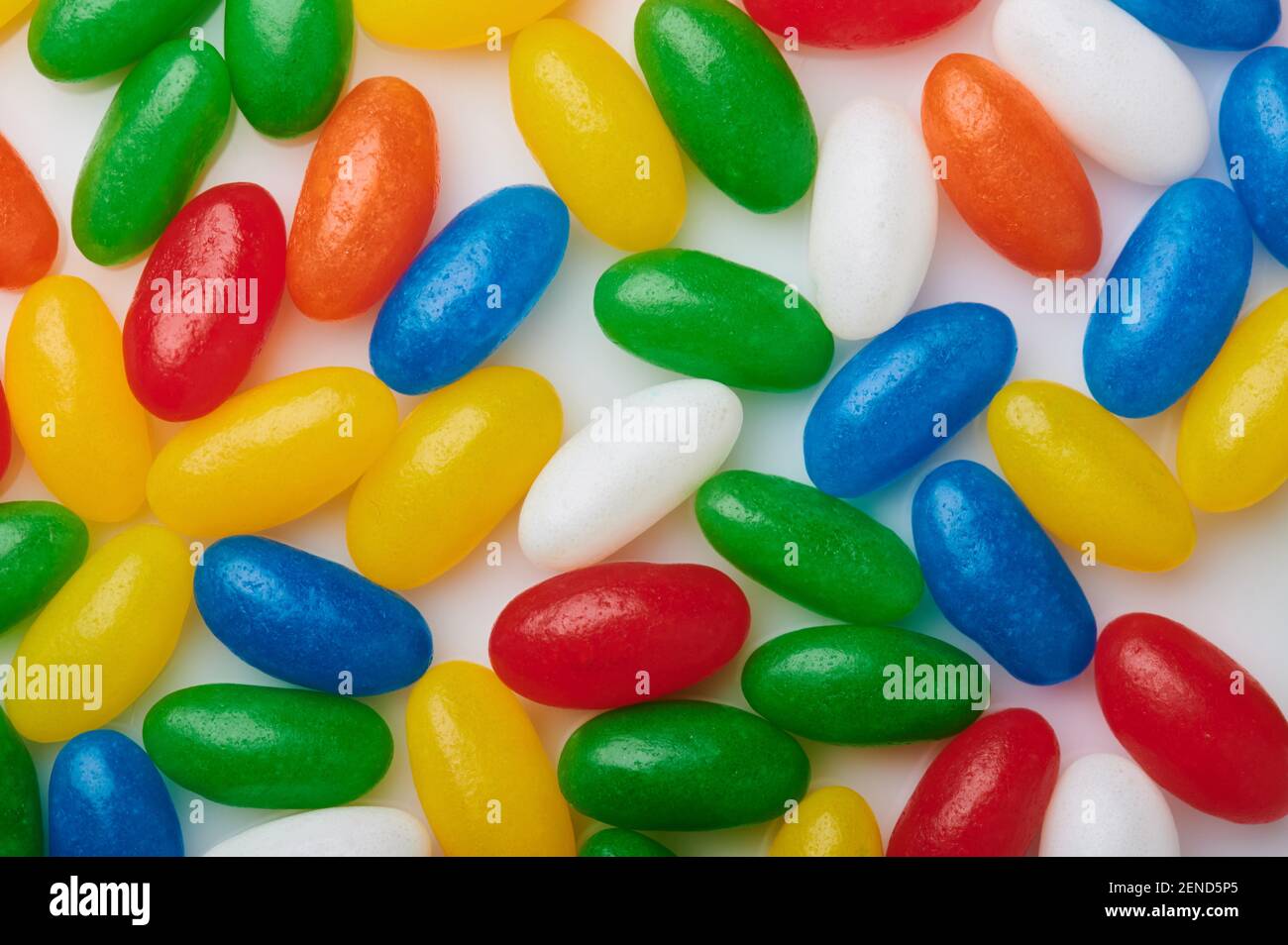 Multicolored oval candy background on white backdrop Stock Photo - Alamy