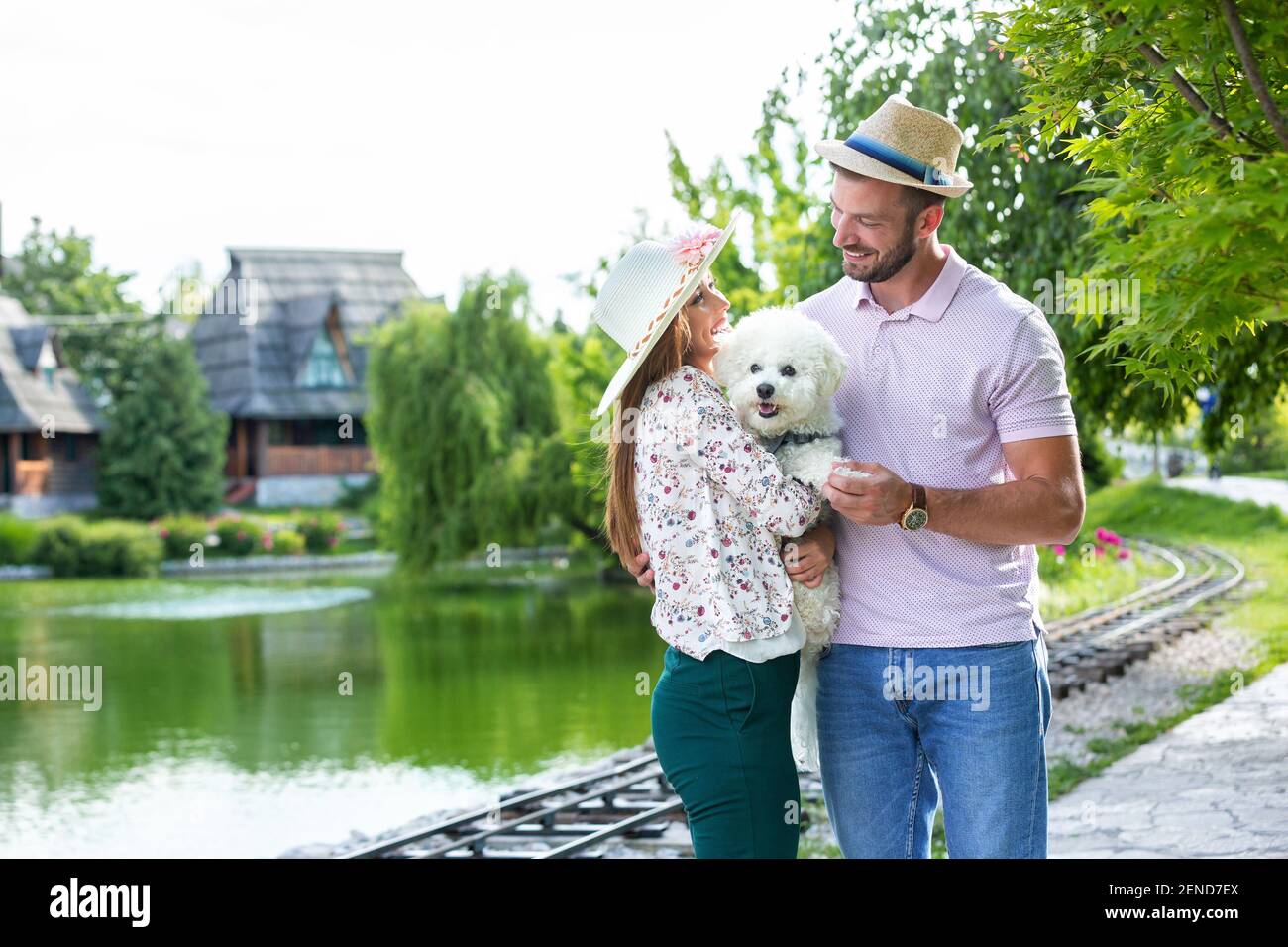 Two people loving each other and their cute dog Stock Photo - Alamy