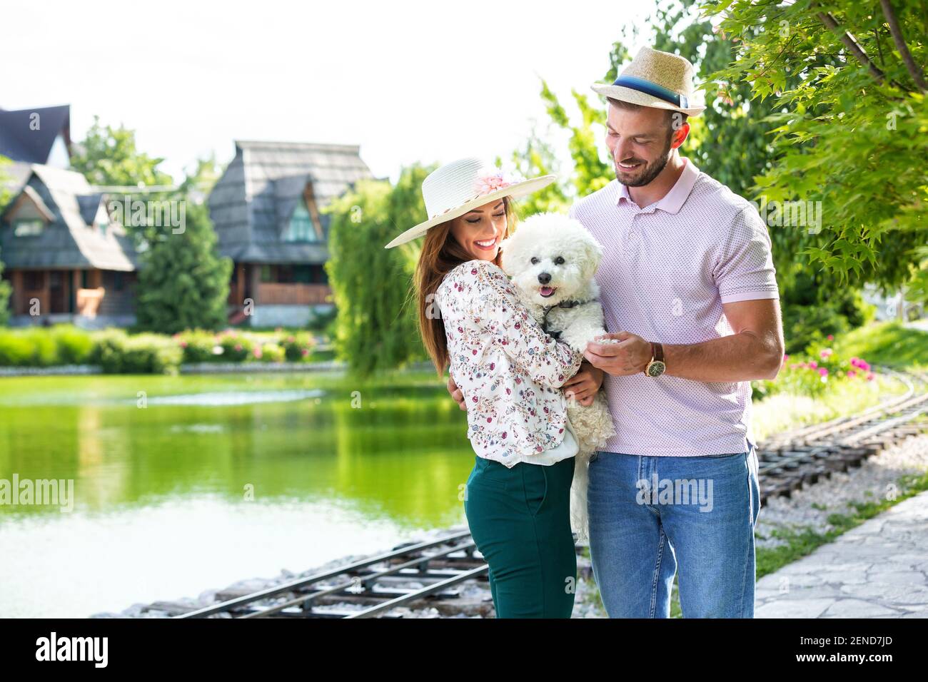 Two people loving each other and their cute dog Stock Photo - Alamy