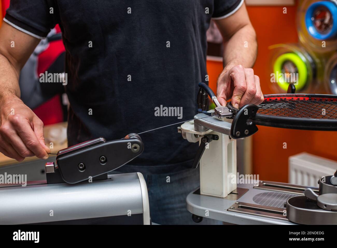 Stringing the tennis racket in the tennis studio Stock Photo - Alamy
