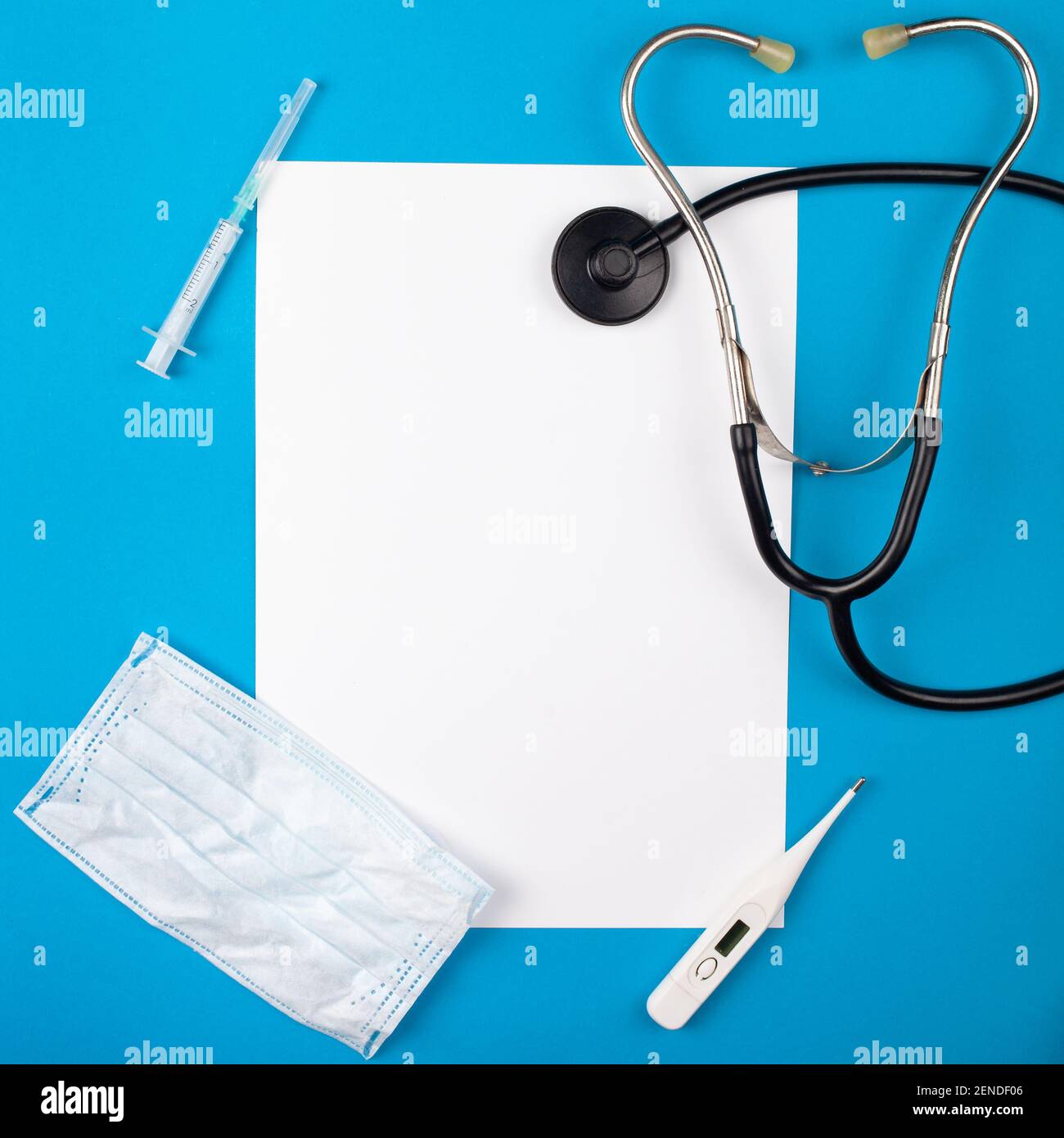 Mocup medicine on a blue background. phonendoscope, medical supplies. flat lay empty white space ...