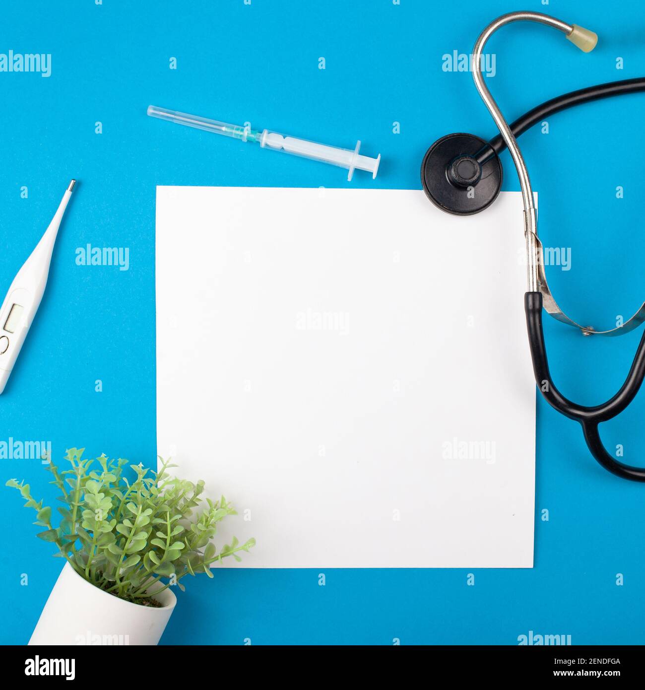 Mocup medicine on a blue background. phonendoscope, medical supplies. flat lay empty white space ...