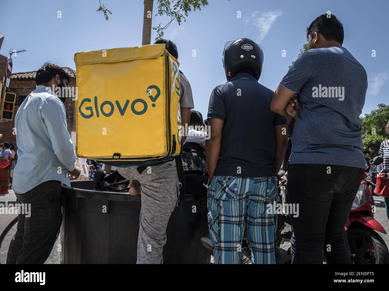 A Glovo worker with his backpack during the rally. Cyclists and ...