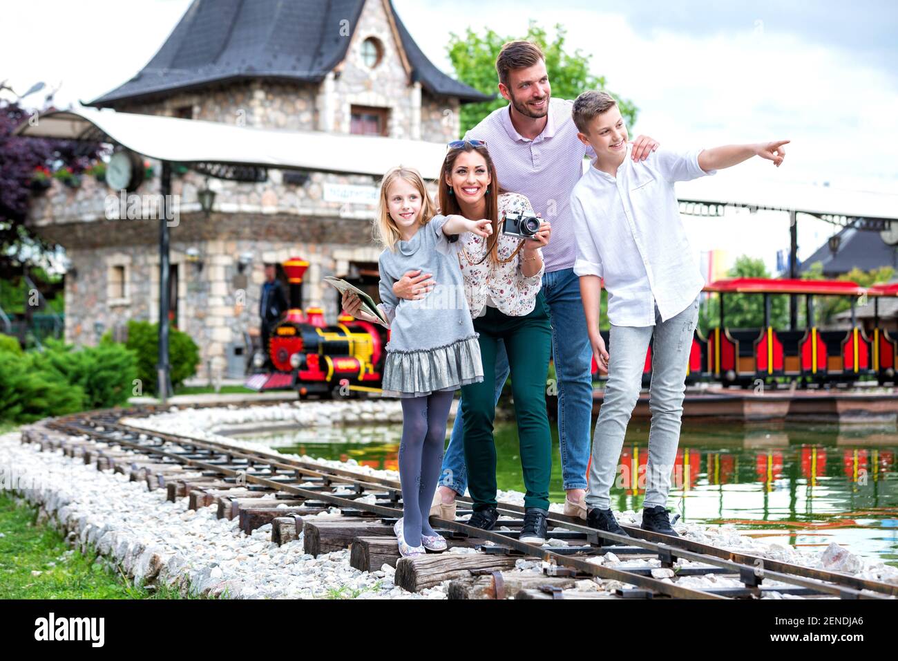 Mom, dad and their children walking on the rails, family moments Stock ...