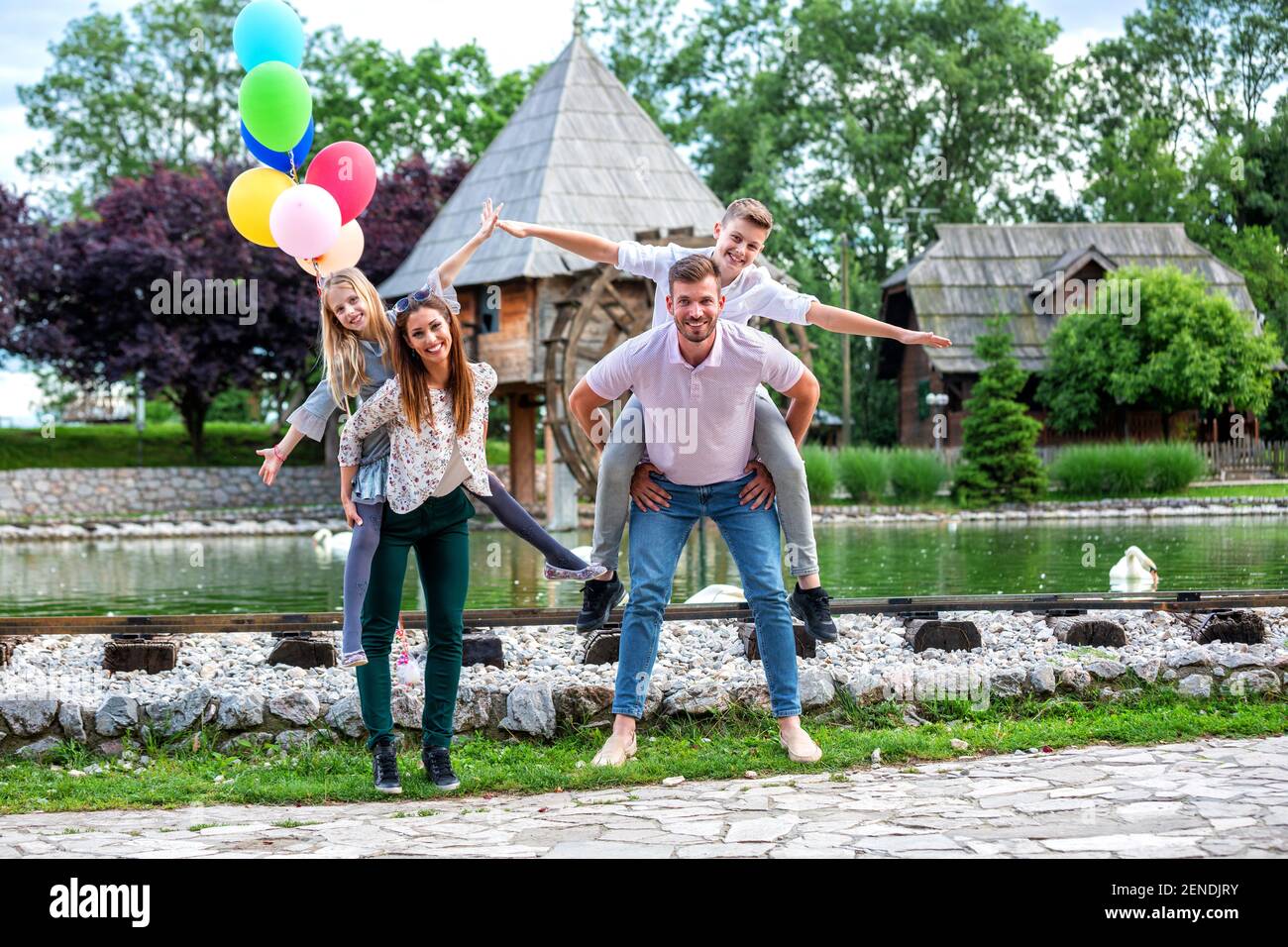 Mom, dad and their kids goofing around while posing for pictures Stock ...