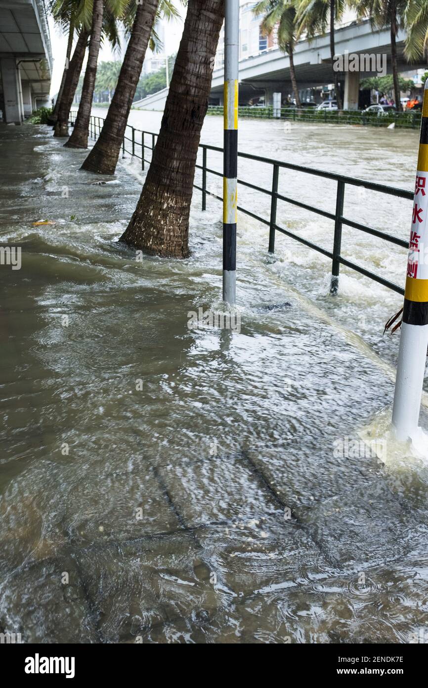 A road is submerged by floodwater after a heavy rainstorm caused by ...