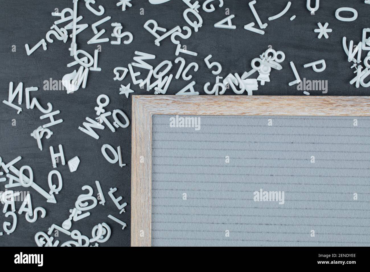 Blank grey frame with white pins and letter symbols around Stock Photo ...