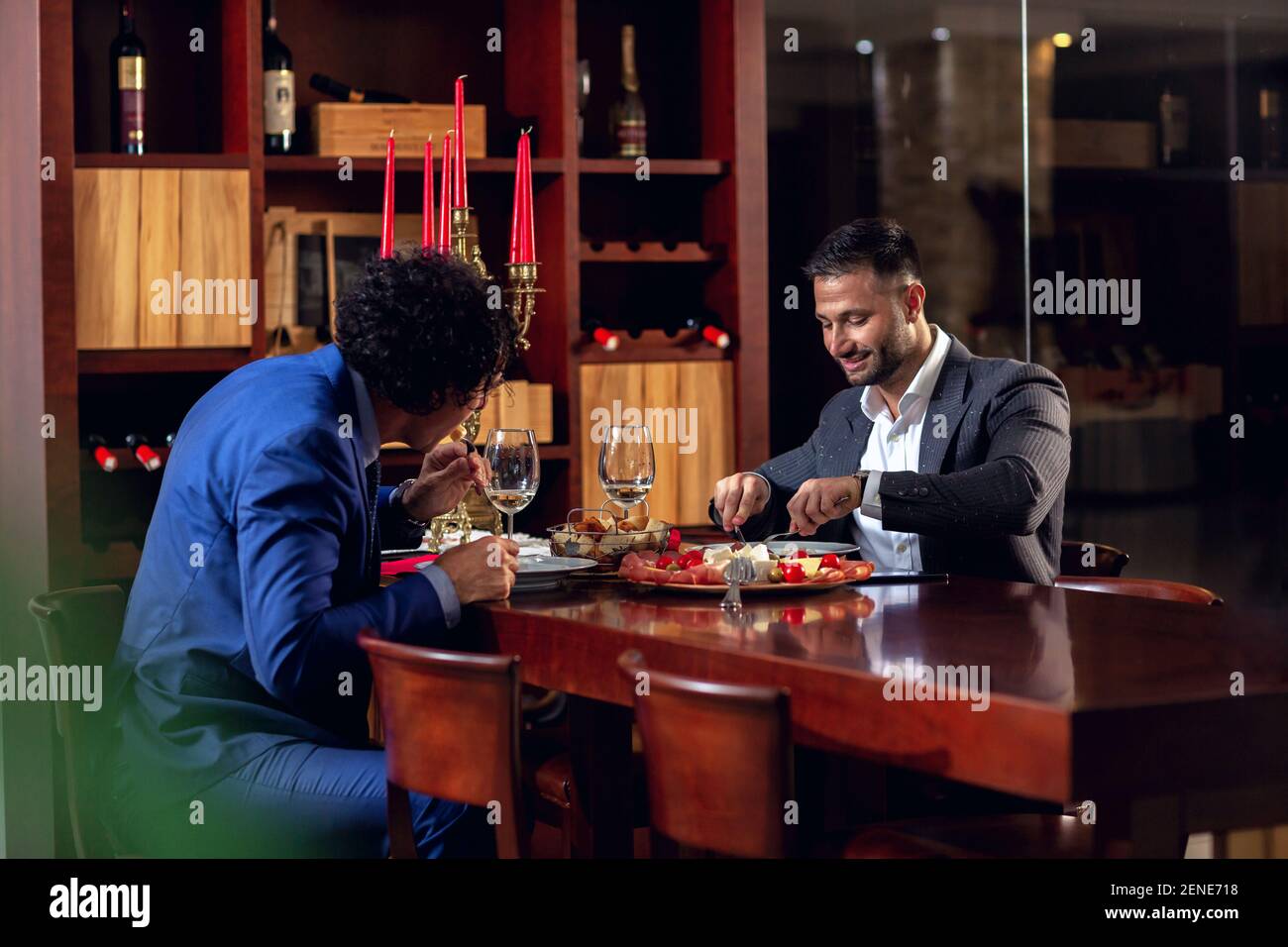 Two successful bosses having dinner, business and businessmen concept ...
