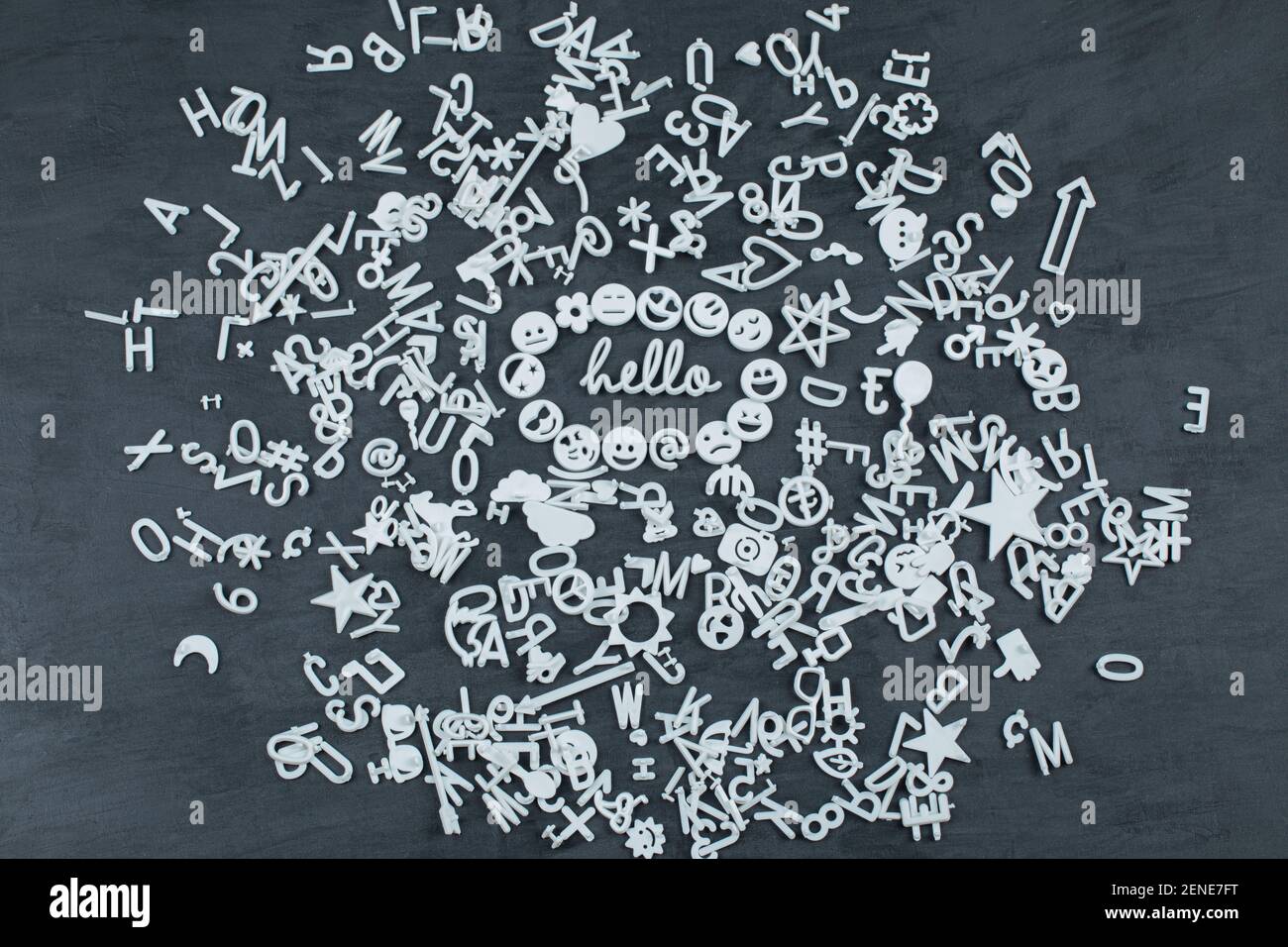 White plastic letters, icons and symbols on grey background Stock Photo ...