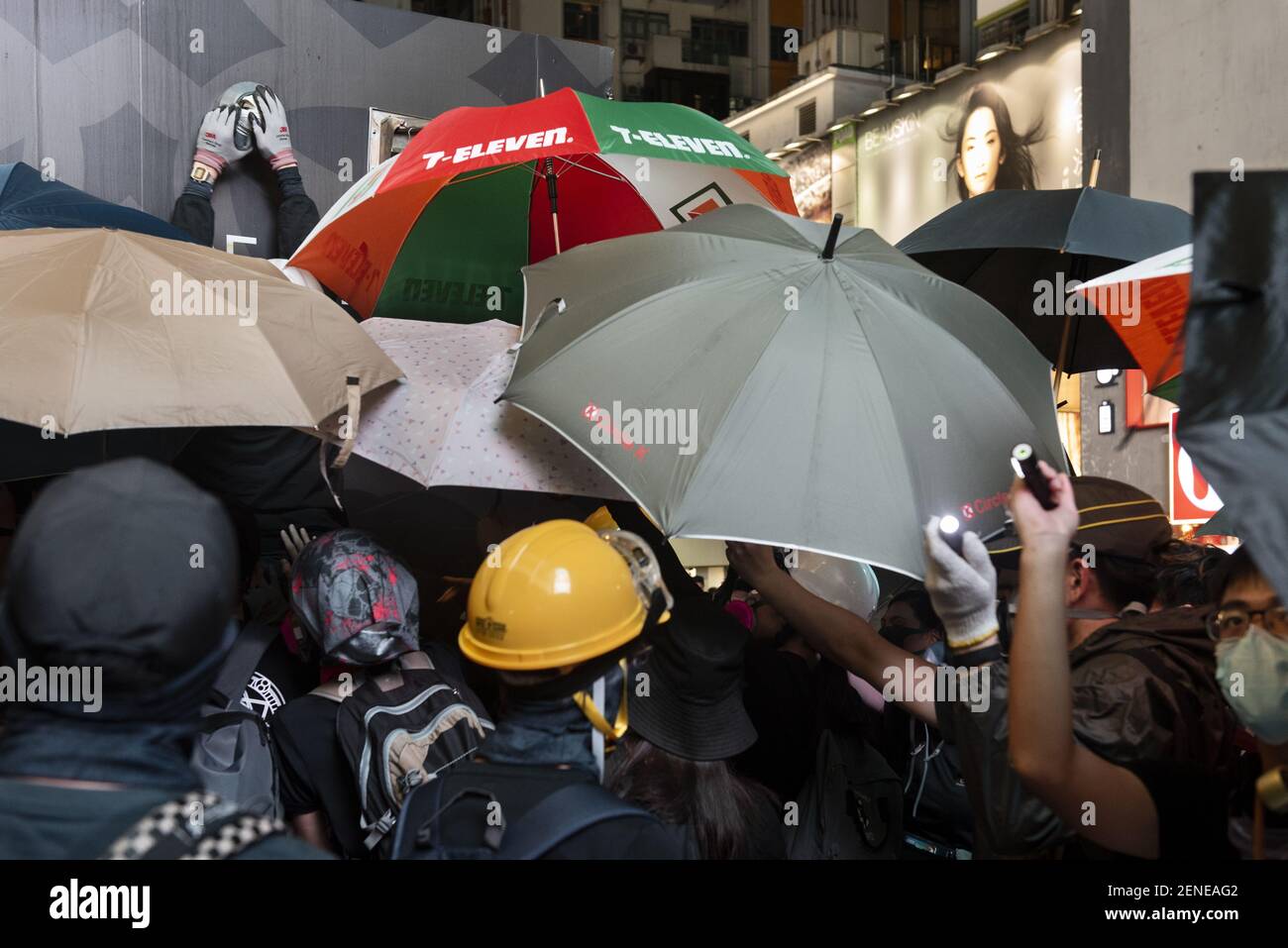 Protester cover a security camera with tape during the protest rally ...
