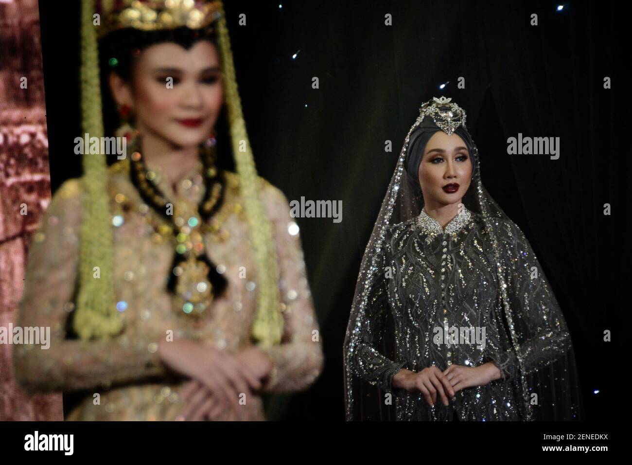 A model walks the runway for the two bridal fashions designed by ...